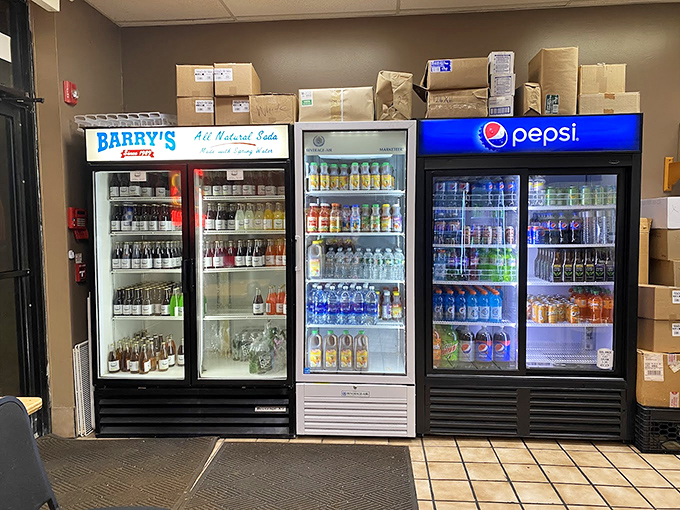 The beverage coolers stand ready like soldiers awaiting orders. Cold drinks on standby to extinguish the fire of spicy sandwiches.