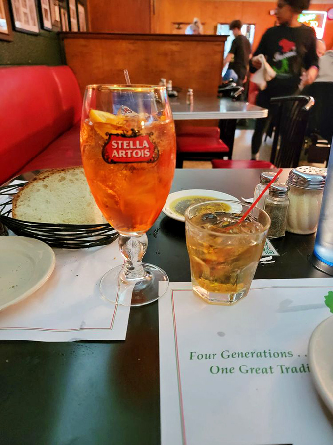 An Aperol Spritz and Old Fashioned sitting at a table that's seen four generations of diners. Some traditions are worth preserving. 