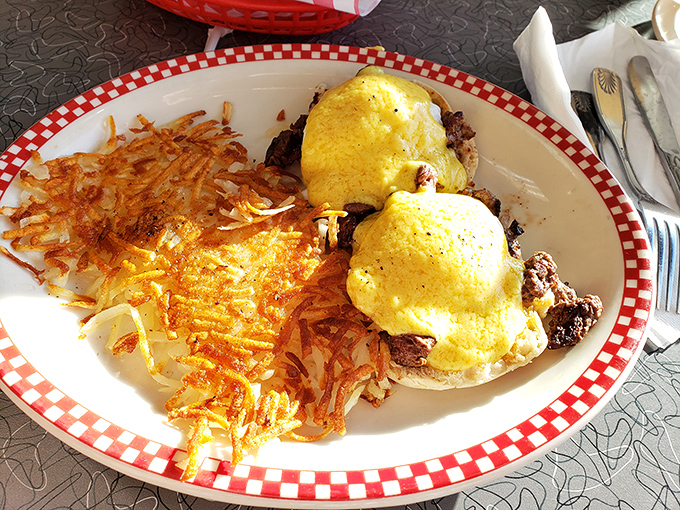 Eggs Benedict with perfectly crisp hashbrowns &ndash; the kind of breakfast that makes you want to high-five the chef and take a nap.