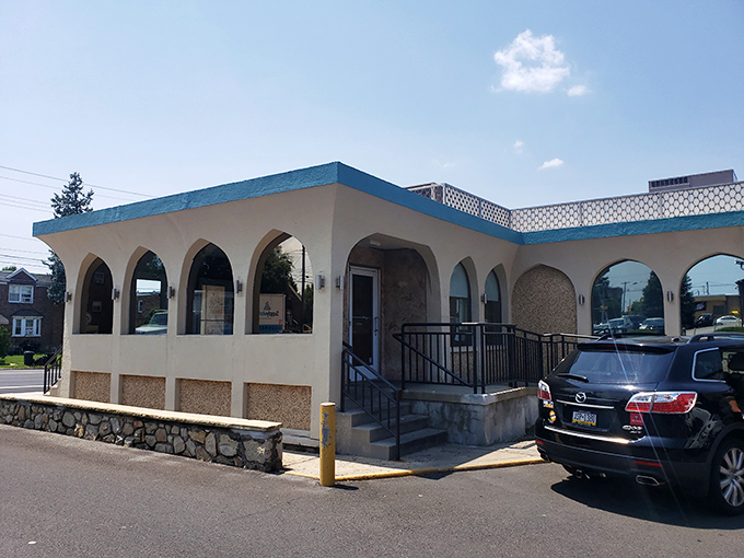 The arched entrance beckons like a portal to a simpler time—when calories didn't count and breakfast could cure anything.