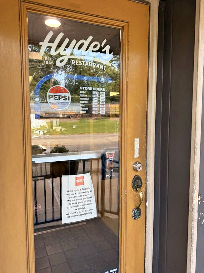 The entrance door, with its vintage lettering and Pepsi logo, serves as a time portal to when restaurants focused on food rather than Instagram opportunities.