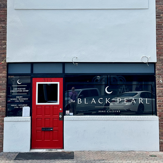 That red door isn't just an entrance&mdash;it's a portal between ordinary Florida afternoon and extraordinary culinary adventure.