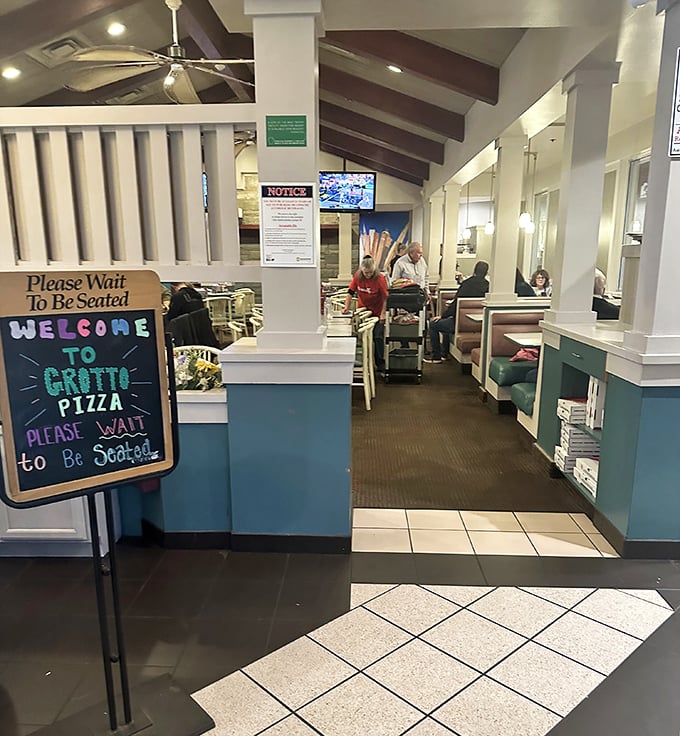 "Please Wait to Be Seated" &ndash; four words that promise delicious things are worth the patience. The blue and white color scheme whispers "trust us, we know pizza."