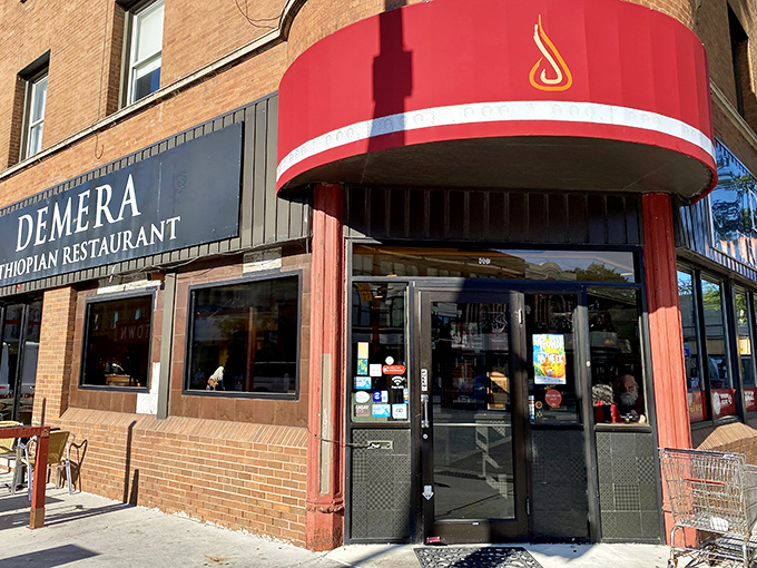 That red awning and flame logo aren't just branding&mdash;they're a promise. What waits inside this corner entrance will change your relationship with dinner forever.