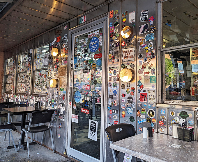 The entrance, plastered with stickers from floor to ceiling, serves as both door and diary &ndash; each decal a tiny chapter in Fleetwood's ongoing story.