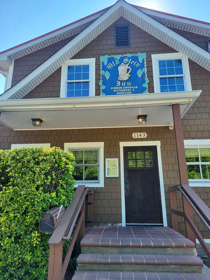 The entrance to Old Stein Inn stands proudly in the Maryland sunshine, its sign a beacon for those seeking schnitzel salvation.