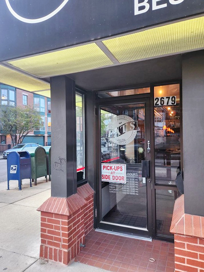 The unassuming entrance to Pat's belies the culinary treasures waiting inside—like finding a secret passage to flavor country.