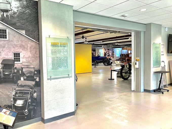 The museum entrance offers a tantalizing glimpse of automotive treasures within, where history buffs and gear-heads alike find common ground.