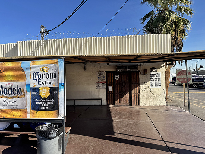 The humble entrance belies the flavor explosion waiting inside. That Corona banner isn't advertising; it's a promise of good times ahead.
