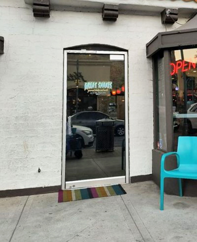 The rainbow welcome mat and turquoise chair say it all: happiness lives here, and it's served with a straw.