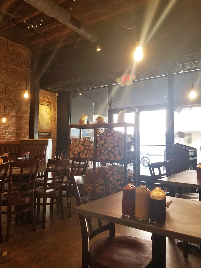 Stacked firewood isn't just for show&mdash;it's a promise of the smoky goodness that awaits your taste buds.