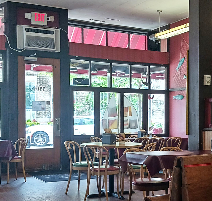 Morning light streams through windows that have framed decades of Vermilion life. Those wooden chairs aren't trying to be vintage&mdash;they earned it honestly.