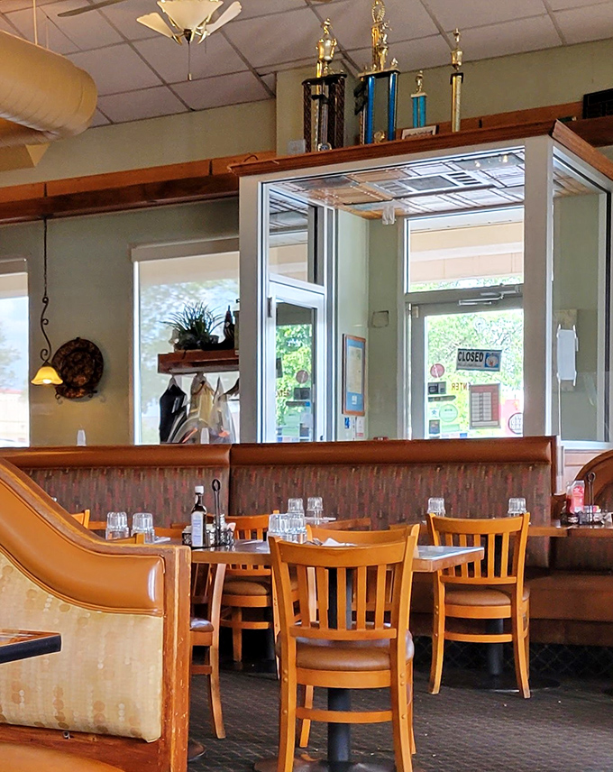 Trophies on display&mdash;perhaps from local competitions or community involvement. In the restaurant world, loyalty is the real prize.