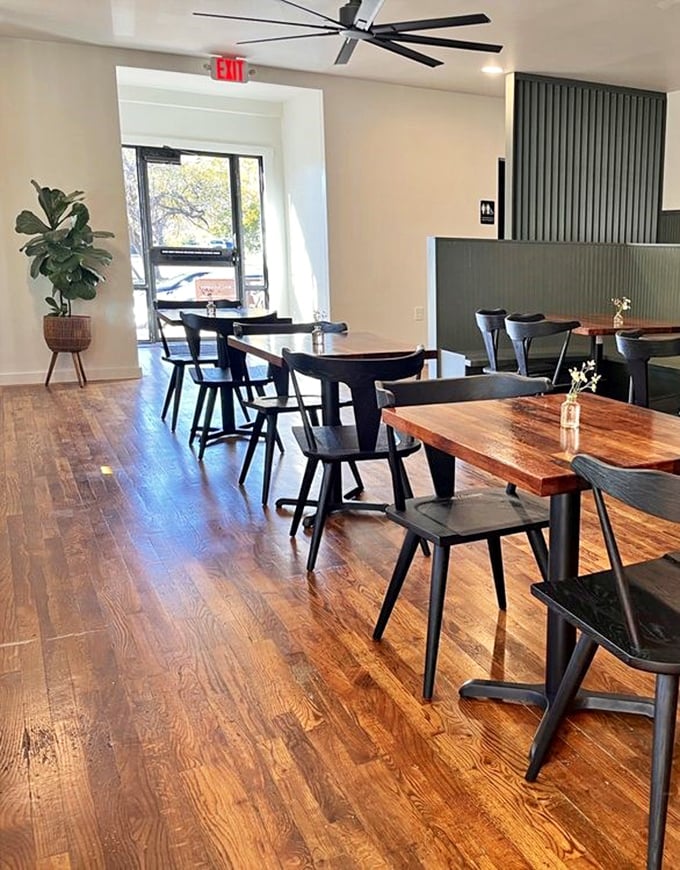 Modern minimalism meets barbecue tradition. Those wooden tables have witnessed more food euphoria than a Michelin-starred restaurant.