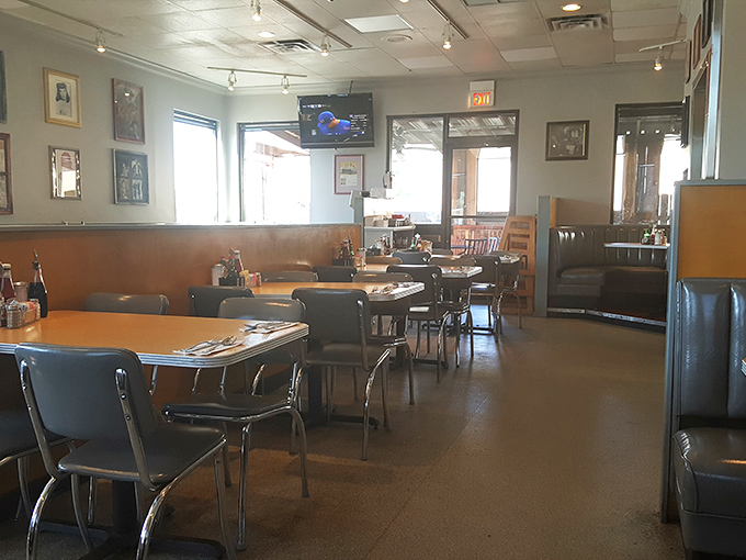 Empty tables waiting for the next rush of hungry patrons, each setting a blank canvas for the culinary masterpieces about to be served.