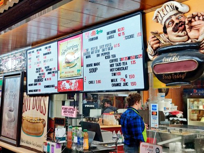 Flea market food—where the menu board promises comfort classics that fuel serious shoppers through marathon bargain-hunting sessions.