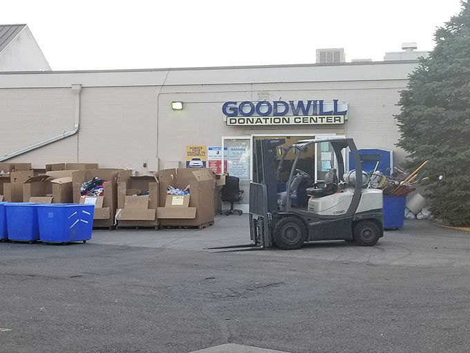 Behind-the-scenes magic! The forklift ballet that transforms donations into organized retail therapy. Every treasure was once in these boxes.