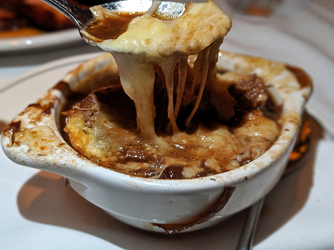 French onion soup pulling the cheese stretch of champions. It's comfort food dressed in a tuxedo, ready for its close-up.