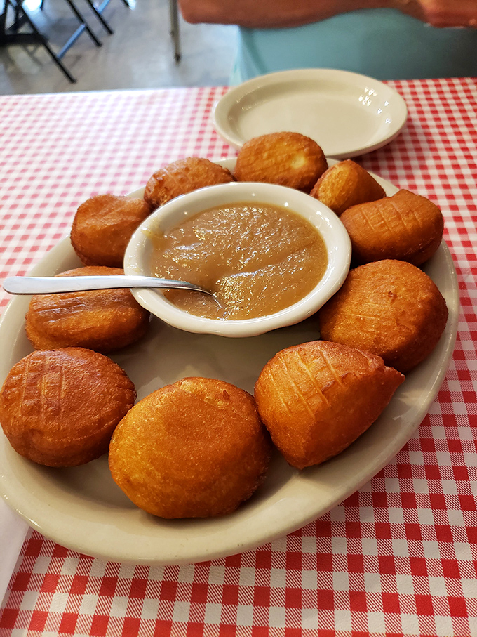 These golden-fried biscuits surrounding apple butter aren't just appetizers&mdash;they're an edible history lesson in Southern ingenuity and deliciousness.