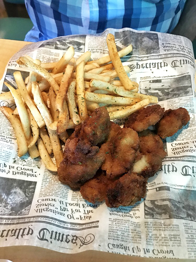 Fried oysters and seasoned fries served on newsprint&mdash;simple, unpretentious, and exactly what seafood should be.