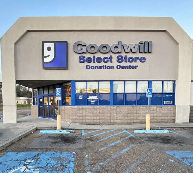 The Goodwill facade at golden hour&mdash;where budget-friendly retail therapy and community service meet under Mississippi skies.