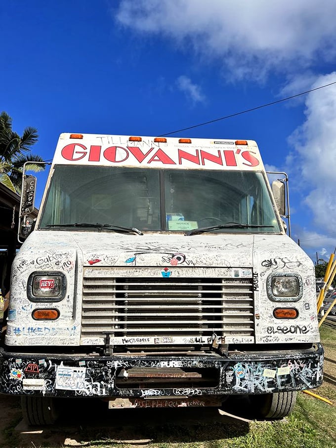Face to face with a legend. Giovanni's distinctive red lettering has greeted hungry visitors for decades, promising seafood salvation just steps away.