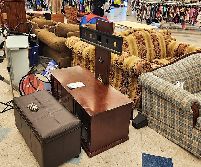 Couches and entertainment centers create a furniture showroom atmosphere. That leather ottoman is practically begging to go home with someone.