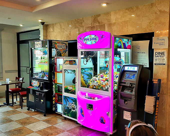 Every family restaurant needs a claw machine—it's where parents teach children important life lessons about probability and disappointment.