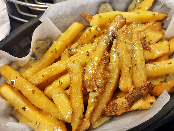 Golden garlic fries glisten with herb-flecked perfection, the kind of side dish that steals the spotlight shamelessly.