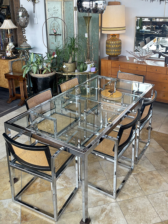 Chrome and glass dining perfection. This table set looks like it teleported straight from a 1970s architectural digest photoshoot.