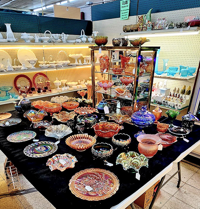 Carnival glass catches light like stained windows in a cathedral of collectibles. Each piece a testament to artistry that refuses to fade.