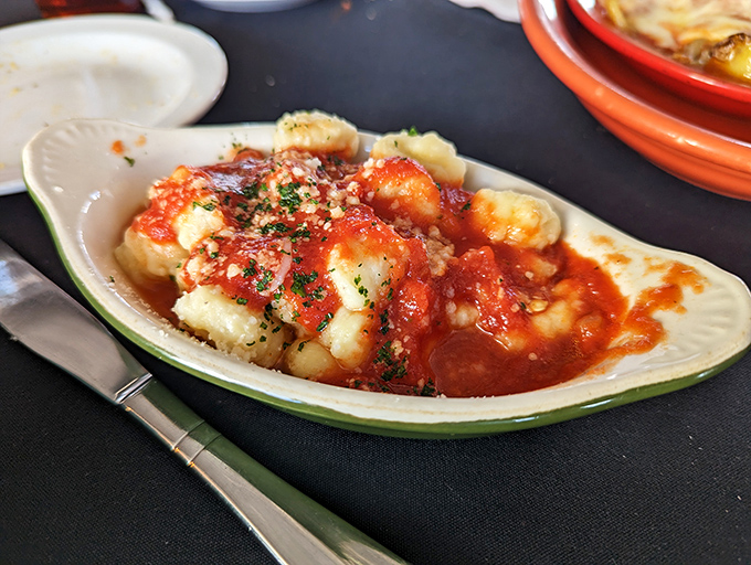 Gnocchi swimming in marinara like little potato pillows taking a tomato bath. Comfort food that speaks Italian with an Ohio accent.