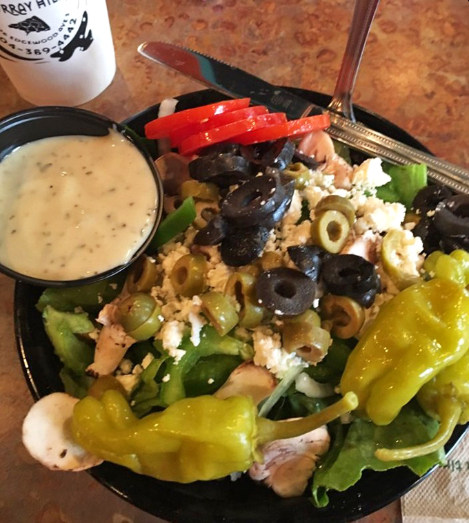 The Greek salad proves Moon River isn't just a one-trick pony—this mountain of olives, feta, and peppers offers a fresh counterpoint to pizza indulgence.