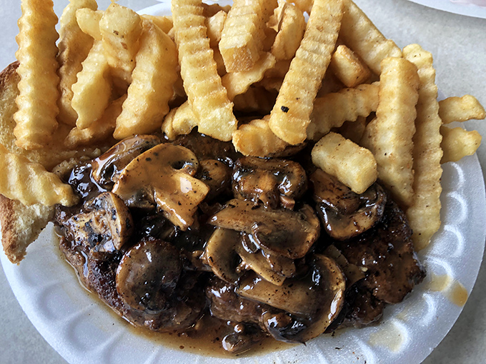 The hamburger steak with mushroom gravy and crinkle-cut fries&mdash;comfort food that whispers, "Everything's going to be alright."