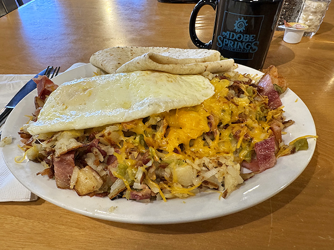 This isn't just breakfast—it's a beautiful mess of potatoes, eggs, meat, and cheese that makes waking up early completely worthwhile.