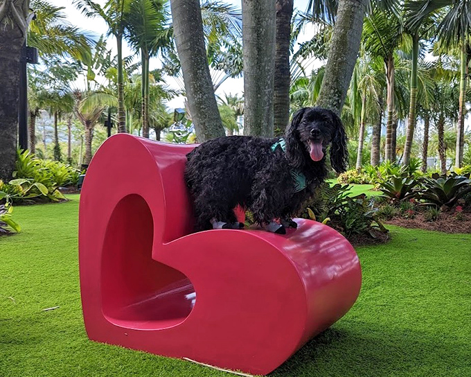 Even the garden's seating celebrates artistic expression—these heart-shaped loungers prove that functional elements can be just as captivating as the sculptures.