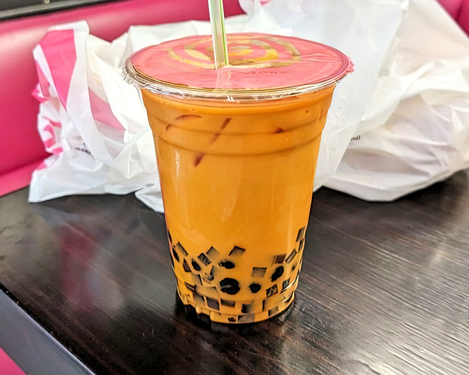 The Thai tea with its perfect boba pearls is basically sunshine in a cup with chewy little surprises.