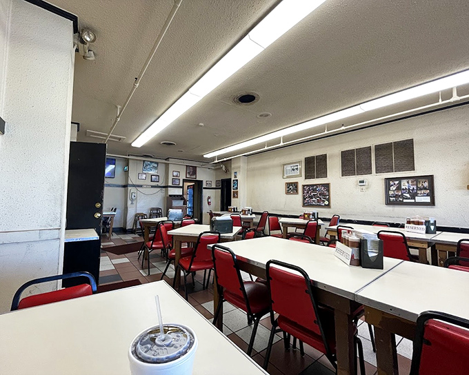 Simple tables, red chairs, and fluorescent lighting&mdash;the unpretentious stage where barbecue magic has happened for decades.