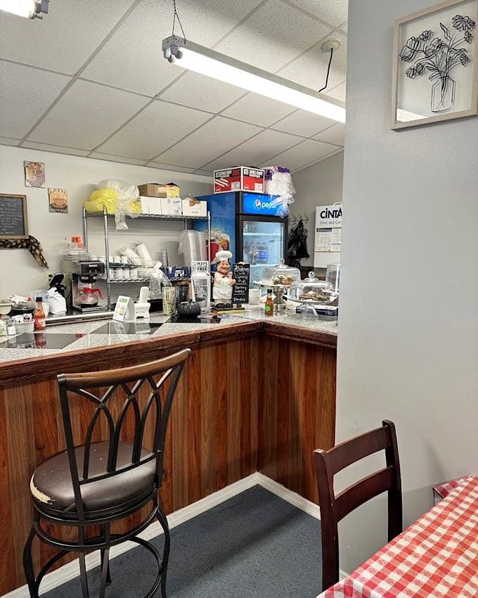 Behind the counter is where breakfast dreams are assembled with military precision and grandmotherly love.
