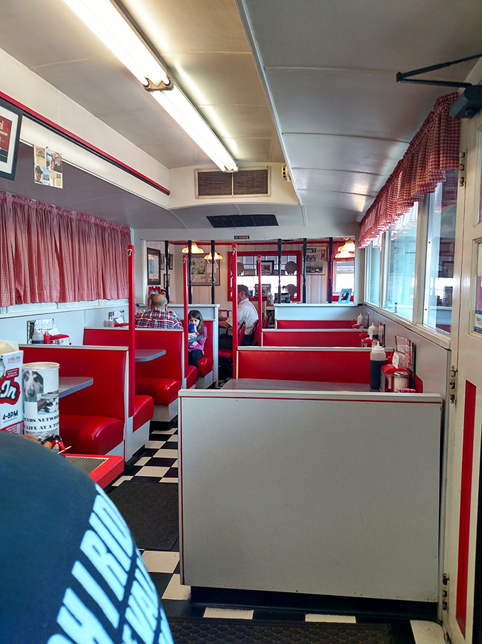 The diner's interior stretches like a railroad car of culinary delights, with each booth offering its own little world of breakfast possibilities.