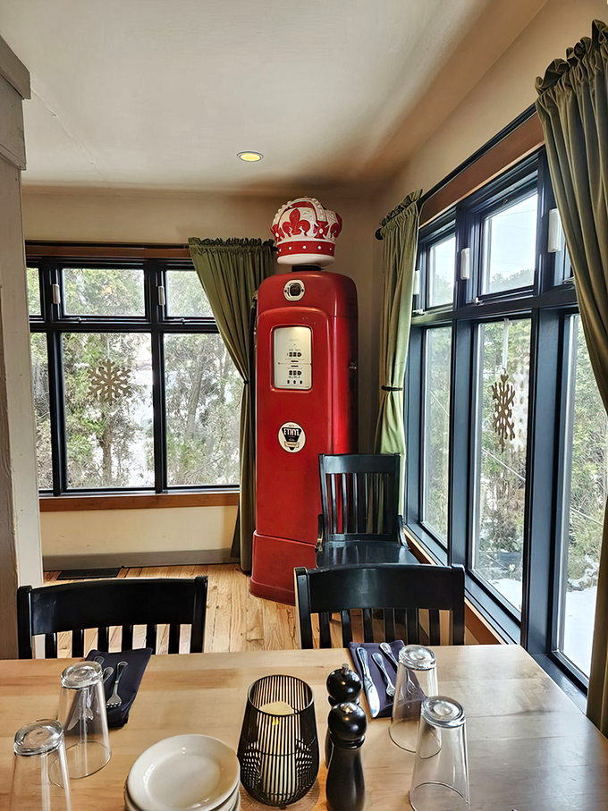 A vintage gas pump adds quirky charm to the bright, airy dining room where windows flood the space with natural light.