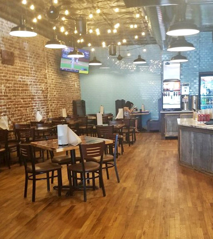 String lights, exposed brick, and wooden floors&mdash;the perfect stage for the real star: whatever's on your tray.