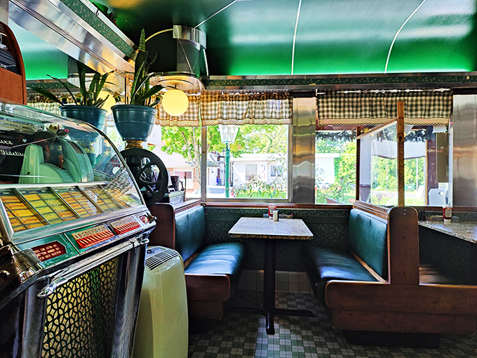 The green ceiling, checkered curtains, and vintage jukebox create the perfect trifecta of diner aesthetics&mdash;not designed by committee but evolved through time.