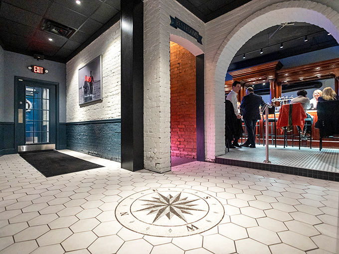 Rich wood, white brick arches, and strategic lighting create the perfect backdrop for seafood that deserves its own spotlight.