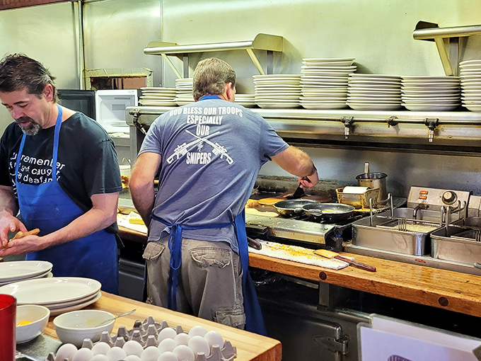 That kitchen crew working the griddle with stacks of plates ready&mdash;efficiency and quality happening simultaneously, like a delicious ballet.