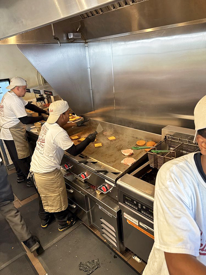 The kitchen ballet&mdash;where skilled hands transform simple ingredients into the burgers that haunt your daydreams.