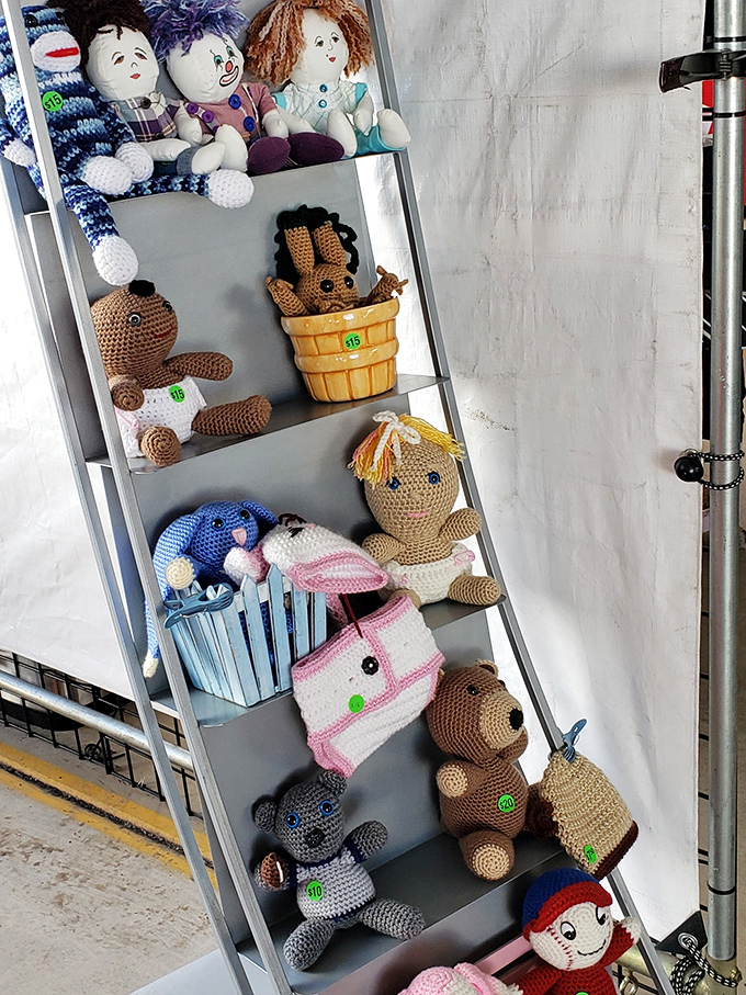 Handcrafted stuffed animals line up like contestants in an adorable pageant, each crocheted creature waiting patiently for its forever home.