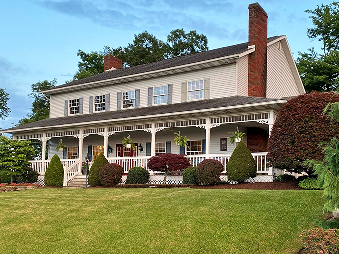 Classic American farmhouse architecture with porches designed for lemonade sipping and firefly watching. Norman Rockwell couldn't have painted it better.