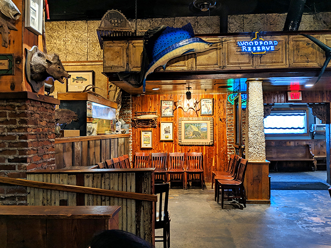 Rustic wooden beams and mounted trophies create dining areas that feel like secret hideaways. That marlin watches over diners like a blue guardian angel.