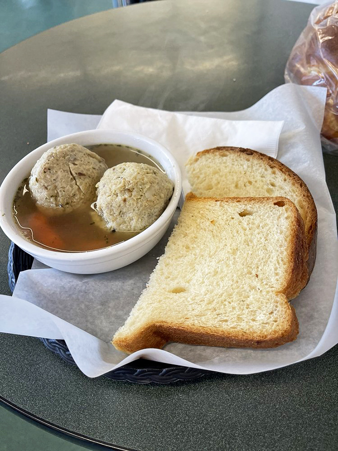 Matzo ball soup: Jewish penicillin served with a side of fresh-baked bread. Comfort in a bowl, Oregon-style.